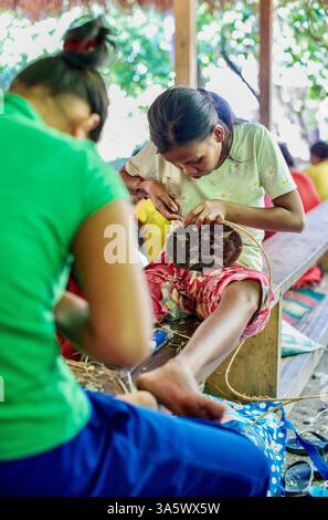 Members of the Iriya tribe, Mindoro’s indigenous people, weave baskets ...