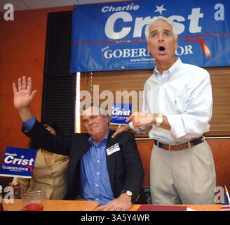 Florida Gov. Charlie Crist , right, and Governor-elect Rick Scott greet ...
