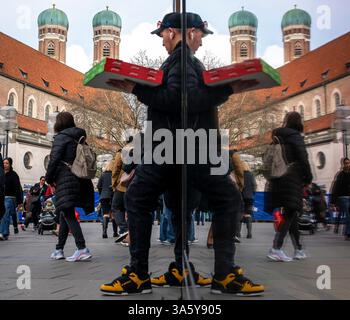 Frauenkirche church towers reflected in the window display of the ...