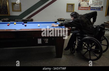 Noel Campos, 30, lines up her shot as she practices 8-ball at Diamond ...