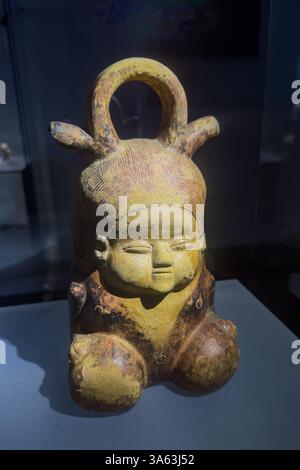 A double-spouted stirrup pot from the Quimbaya Culture in the La Merced ...