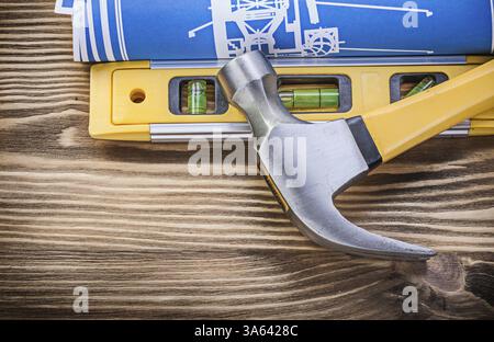 Construction level drawing claw hammer on vintage wooden board Stock ...