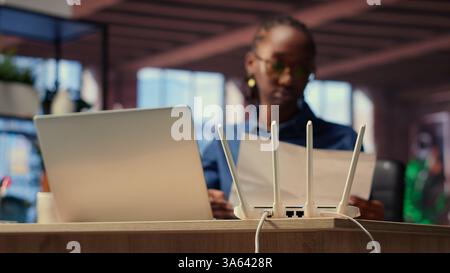 Young woman struggling with weak internet connection at home, pulling ...