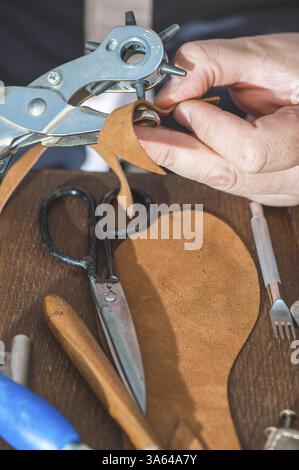 Making shoes manual. Leather sandals Stock Photo - Alamy