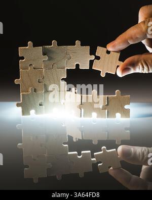 Wooden puzzle and backlight background Stock Photo - Alamy