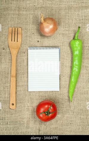 spices and vegetables around notebook Stock Photo - Alamy