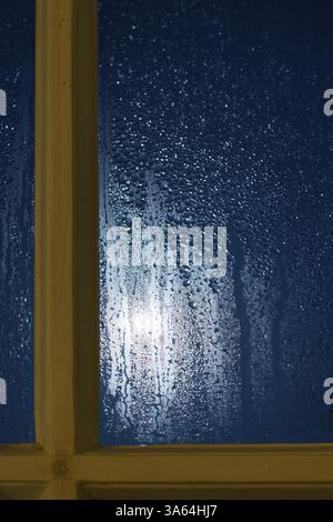 Moonlight through the window. Sweaty glass Stock Photo - Alamy