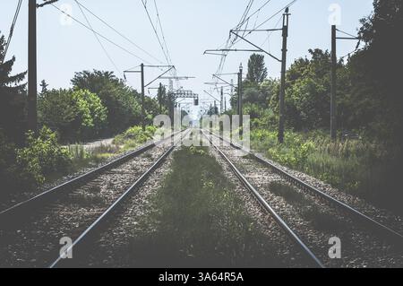 Two Railroads and power poles Stock Photo - Alamy