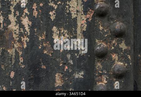 Black metal wall with rivets Stock Photo - Alamy