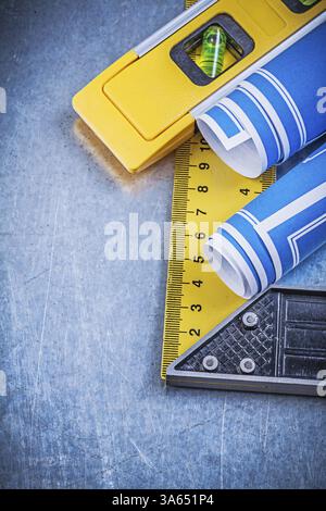 Construction level try square rolled blueprint wooden meter and claw ...