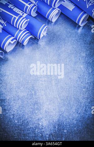Pile of blue engineering drawings on grey background construction ...