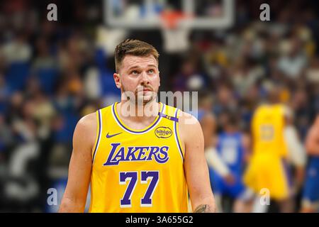 Los Angeles Lakers guard Luka Doncic brings the ball up court during the first half of an NBA ...