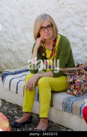 Blonde woman exudes confidence in stylish denim attire, showcasing her ...