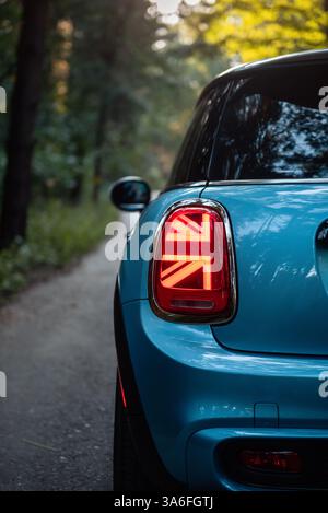 Side view of light blue hatchback car is isolated on white background ...