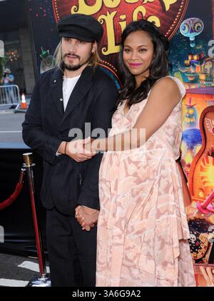 (L-R) Marco Perego and Zoe Saldana arrives at Marvel Studios ...