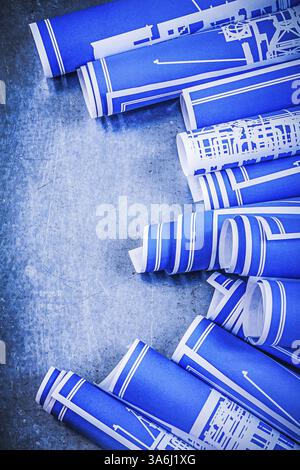 Stack of rolled construction plans on wooden background Stock Photo - Alamy