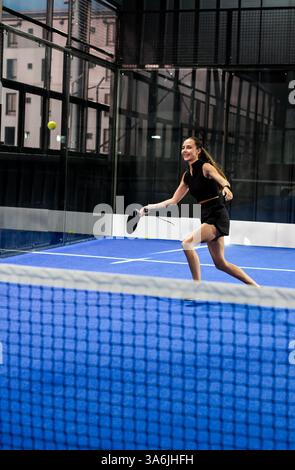 Woman padel tennis player training on court Stock Photo - Alamy