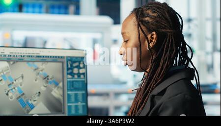 Photovoltaics factory programmer coding on PC to improve solar panels ...