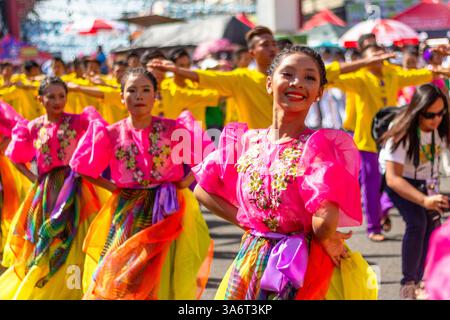 Colorful costumed street dancers during the Dinagyang Festival in ...