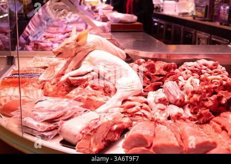 Raw piglet whole carcass in refrigerator cabinet of butcher shop Stock ...