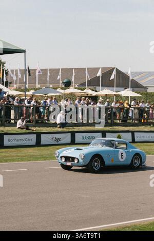 Blue Ferrari 250 GT SWB exclusive classic sports car driven on a street ...
