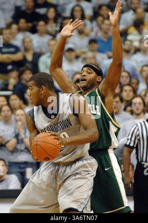 Georgetown center Greg Monroe (10) works the ball into the lane against ...