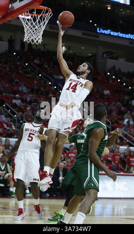 North Carolina State's Caleb Martin (14) celebrates a dunk during the ...