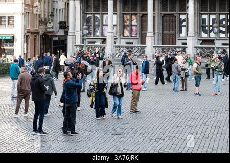 Mixed crowd of people visiting Grand Place in Brussels old town ...