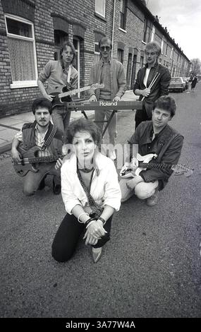 1985, members of the local pop group, Dance Reaction, posing in street ...