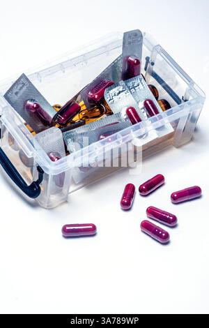 Red pills spilling from blister pack in transparent plastic box Stock ...