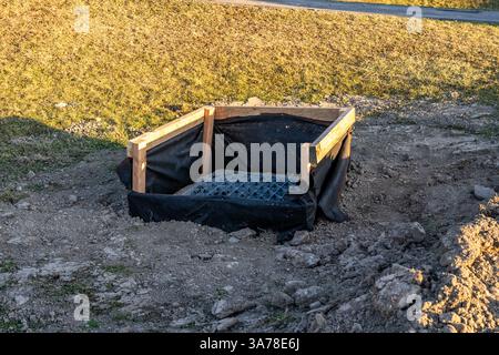 Photo of temporary silt fence, silt trap, around a storm inlet on a ...