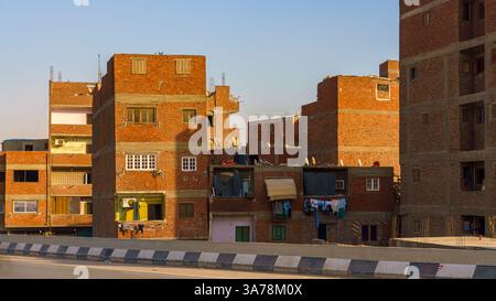 Cairo, Egypt - Mar 11 2023, panoramic view of the slum while driving on ...