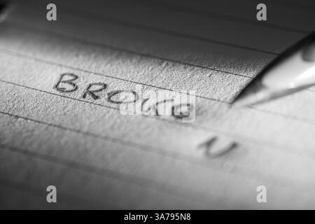 Broken words written at the paper Stock Photo - Alamy