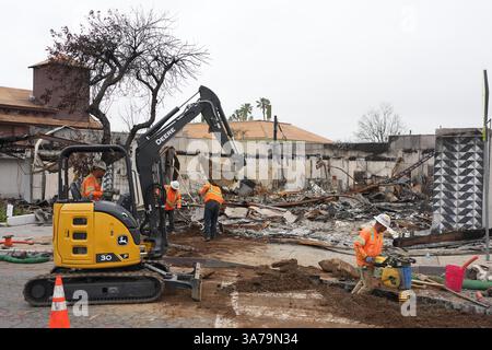 VCI Construction workers clear the Eaton fire burned property of the ...
