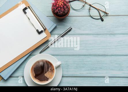 Clipboard with blank to do list and eyeglasses on light wooden ...
