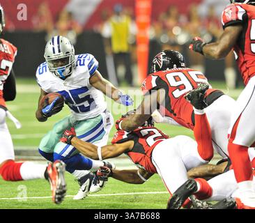 Dallas Cowboys running back Lance Dunbar (25) gets upended by Arizona ...