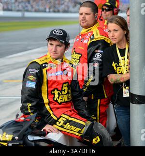 Three time NASCAR Sprint Cup Series Champion Jimmie Johnson, third from ...