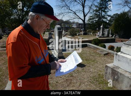 March 21, 2013 - Atlanta, GA, USA - Alan Morris shows graves of some of ...