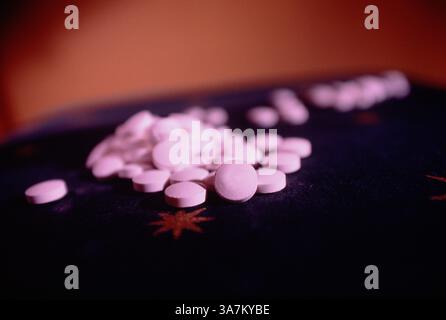 Pills, tablets, drugs, meds, medications on white surface - close up ...