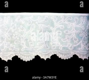A delicate lace trim features intricate floral and architectural ...