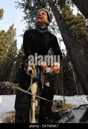 Four-time champion Martin Buser drives his team during the Iditarod ...