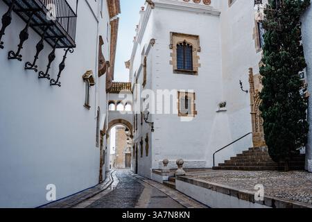View of the a small street and alleys of Sitges, medieval Spanish town ...