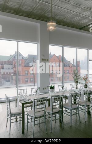 A beautifully arranged dining table in a sophisticated hall, featuring ...