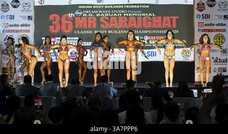 Female bodybuilders pose on stage as they compete the 4th Ms Saraighat ...