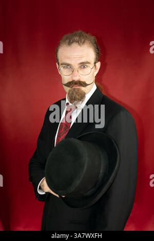 Vintage Caucasian Magician with top hat, glasses and mustache posing ...