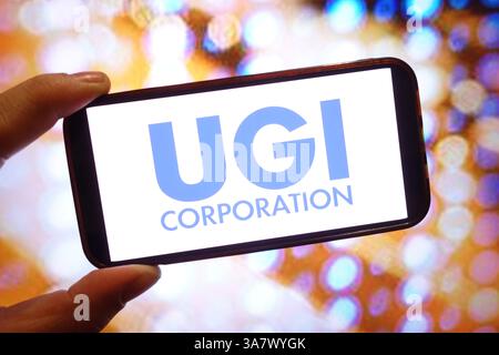 In this photo illustration, the UGI Corporation logo is seen displayed ...