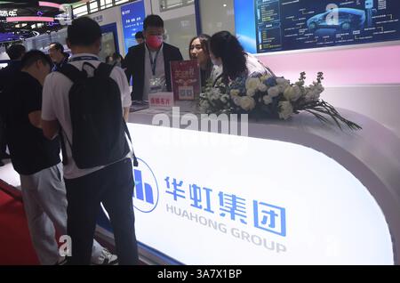 SHANGHAI, CHINA - MARCH 26, 2025 - Visitors visit ASML's lithography equipment at SEMICON China ...