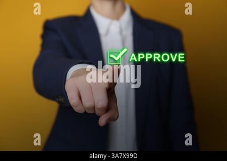 Business woman touching button Approve on virtual screen against black ...