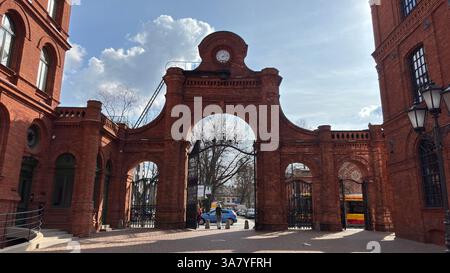 Brick entrance gate to Izrael Poznanski cotton factory building with ...