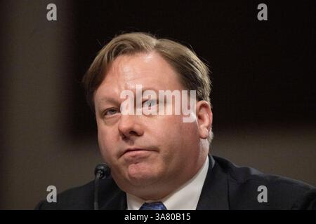 Michael Duffy makes opening remarks at a Senate Committee on Armed ...